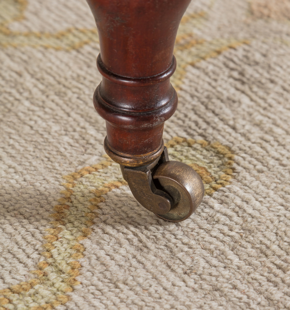 A late 19th Century mahogany slipper chair, stamped 'C Hindley' in red ...