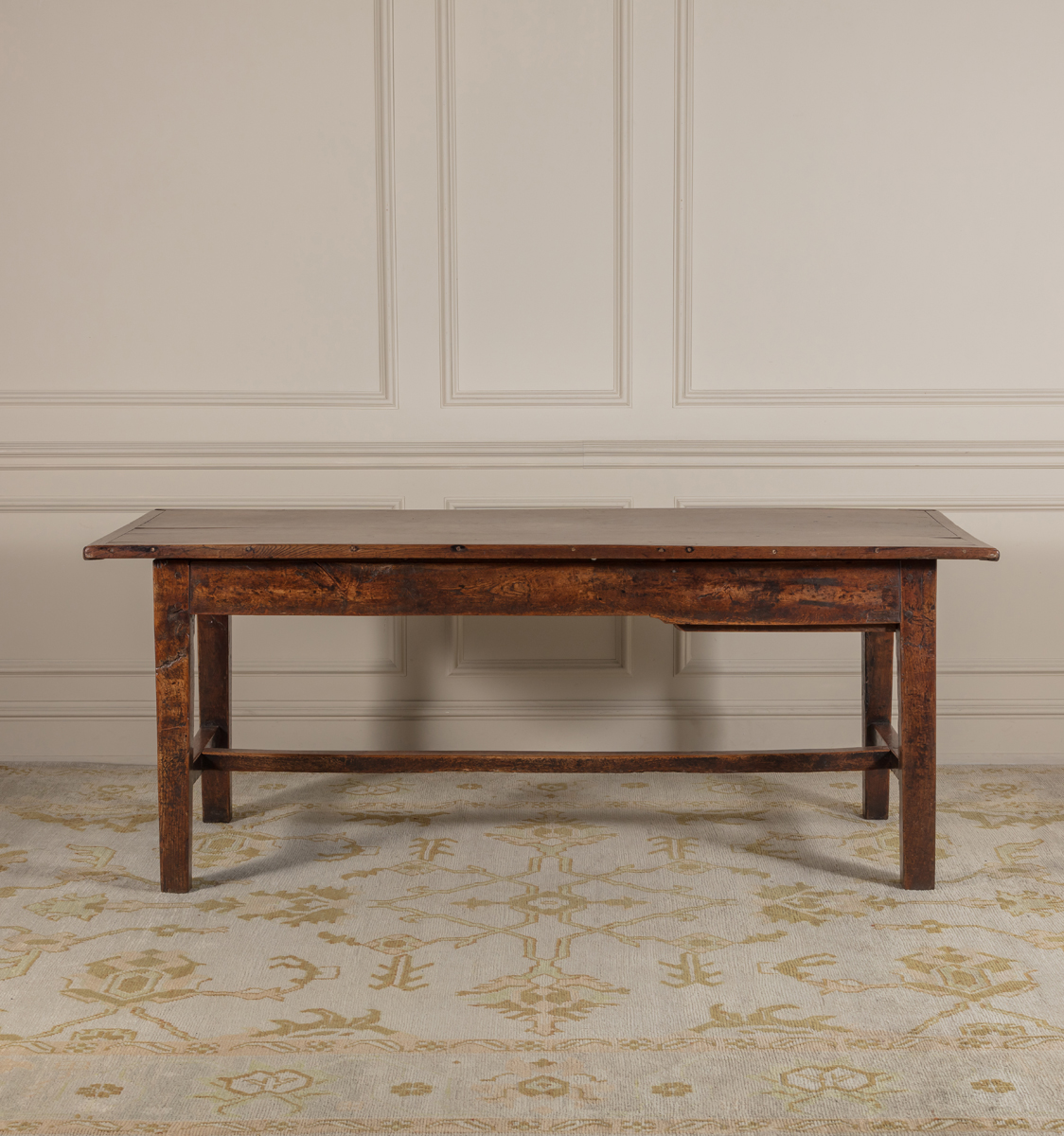 An elm farmhouse table with frieze drawer, circa 1840