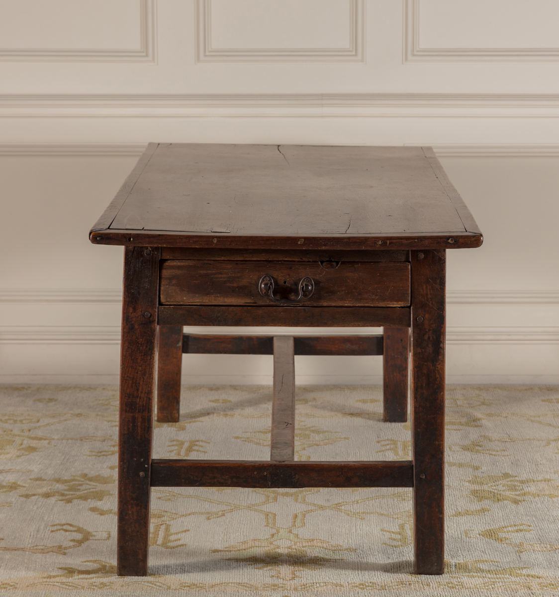 An elm farmhouse table with frieze drawer, circa 1840